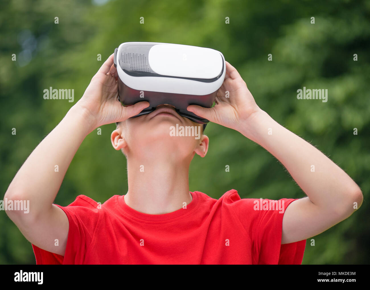Teen boy with VR glasses Stock Photo - Alamy