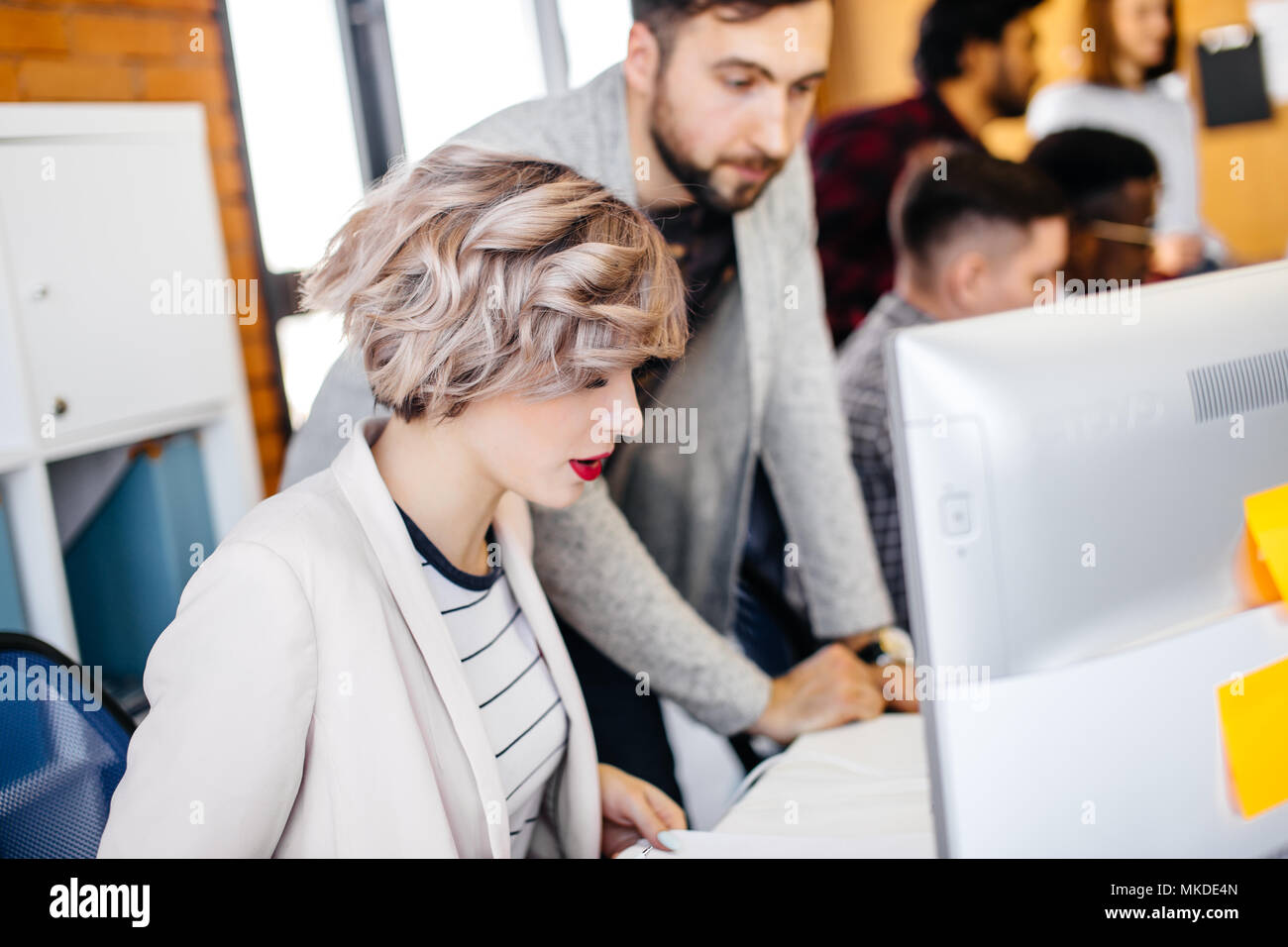 Startup good-looking business partners working together in loft office ...