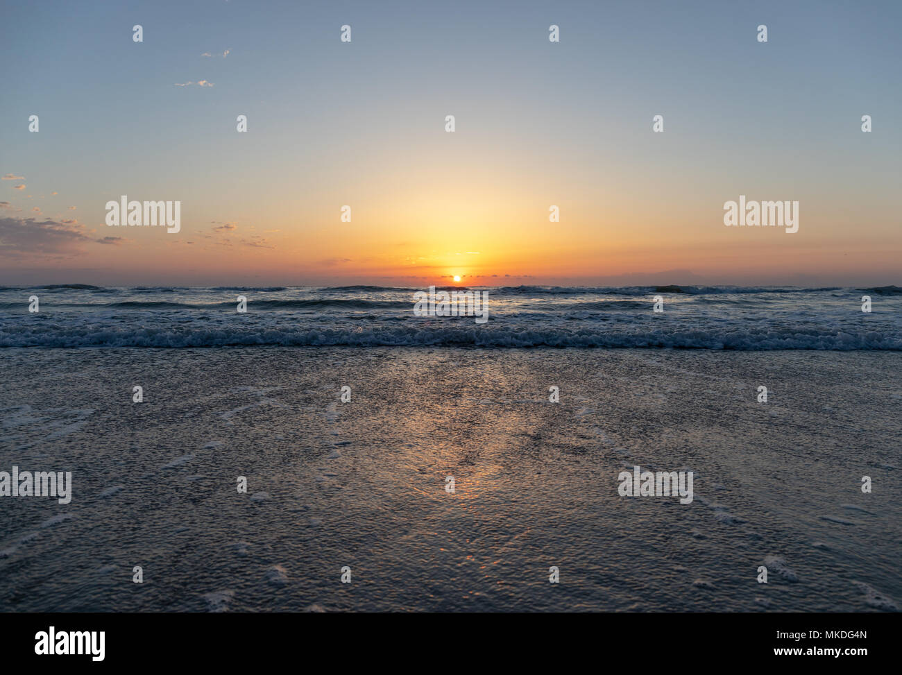 Sunrise on the beach Stock Photo - Alamy