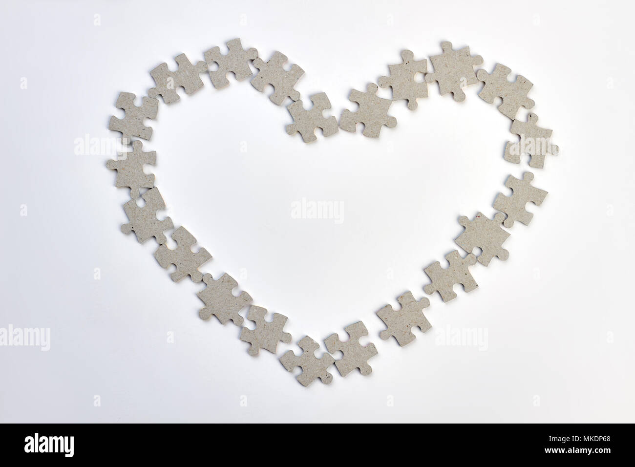 Heart frame made from puzzles. Shape of heart from jigsaw puzzles over ...