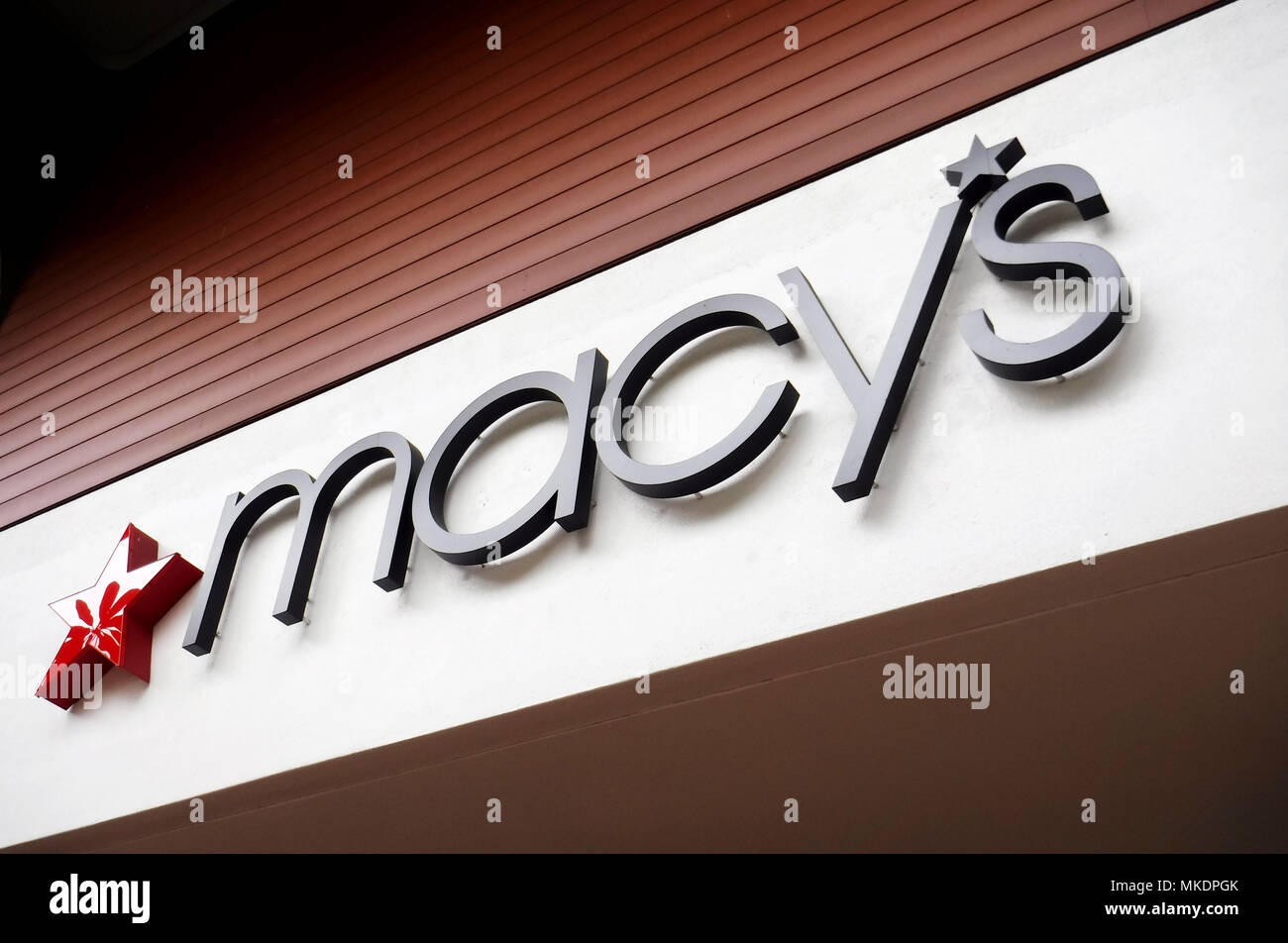 Macy's sign with reflection of palm tree in the star. Taken at Waikiki ...