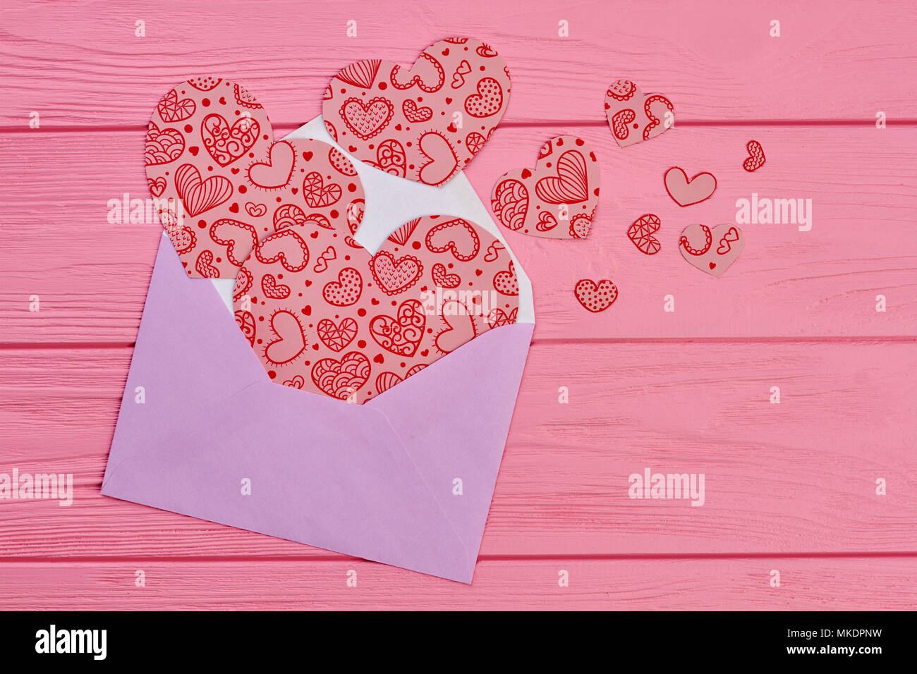 Pink envelope with heart shaped cutouts. Valentines Day envelope with ...