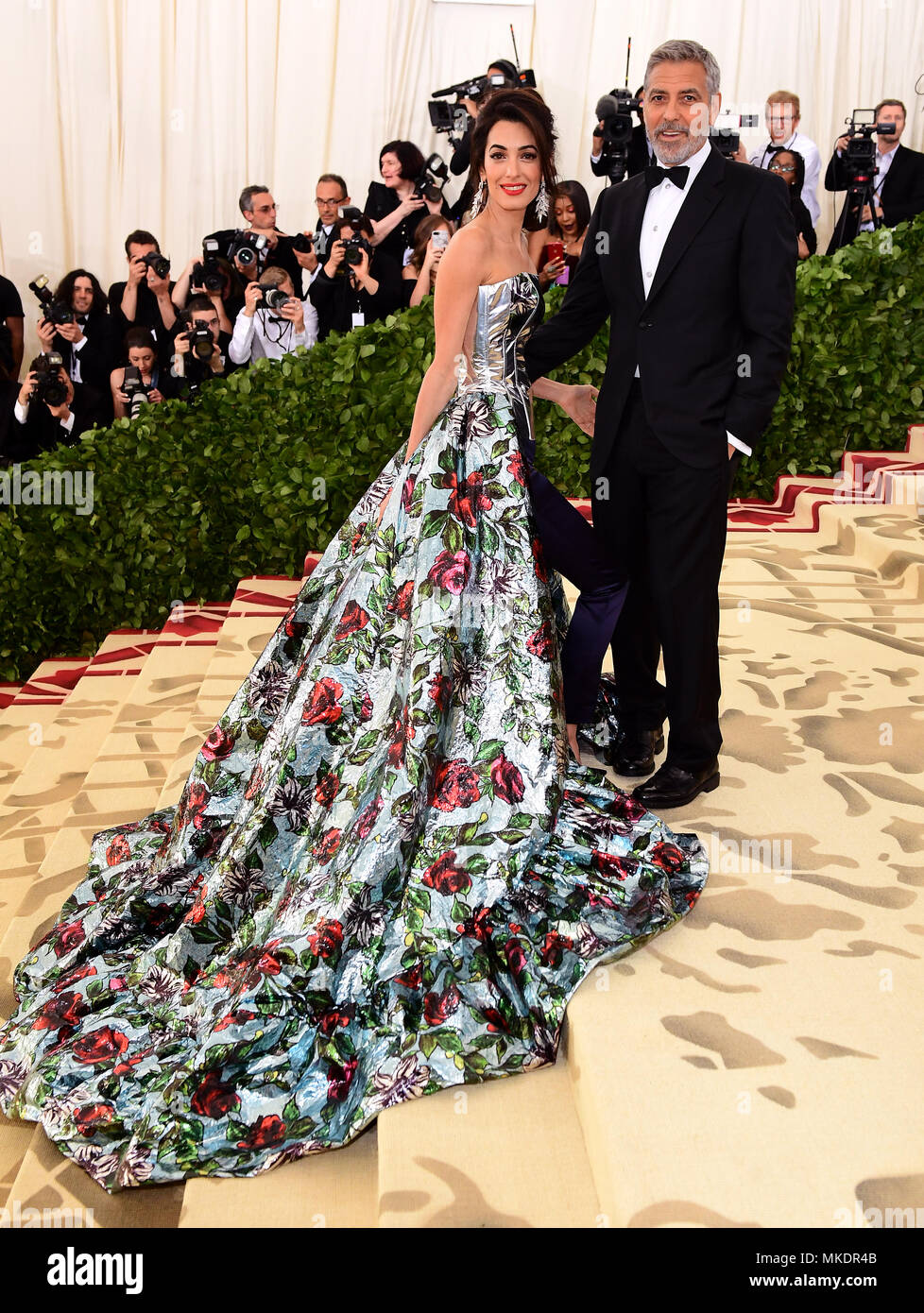 Amal and George Clooney attending the Metropolitan Museum of Art ...