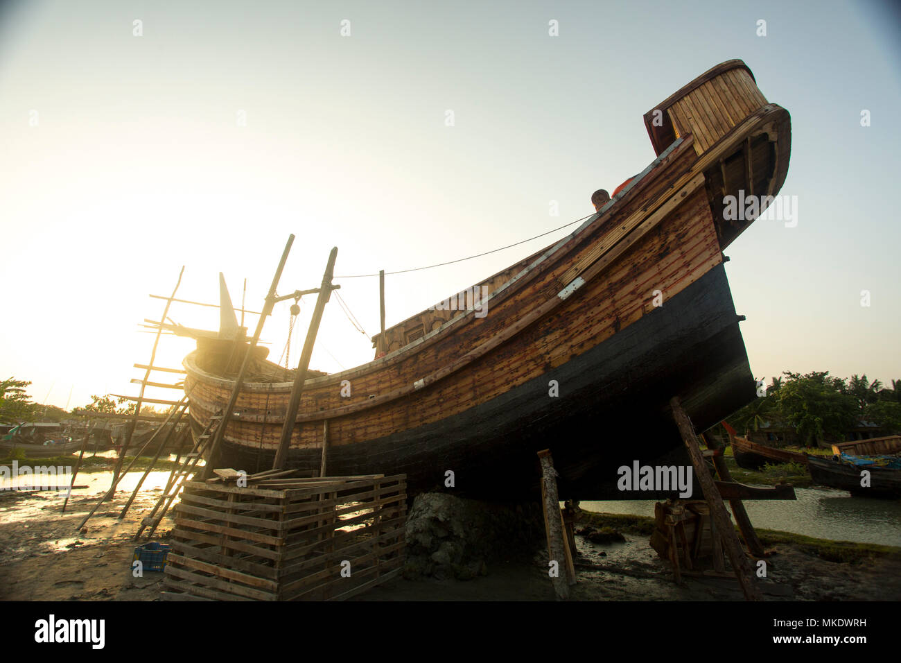 In the last light of Twilight, a ship making labor is finishing his ...