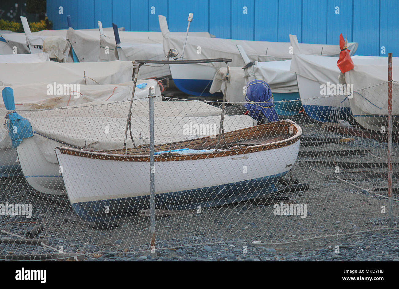 some covered boats on the beach Stock Photo - Alamy