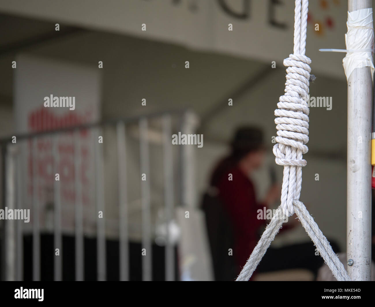 A white rope knot hoping up a tent for a performance on stage Stock ...