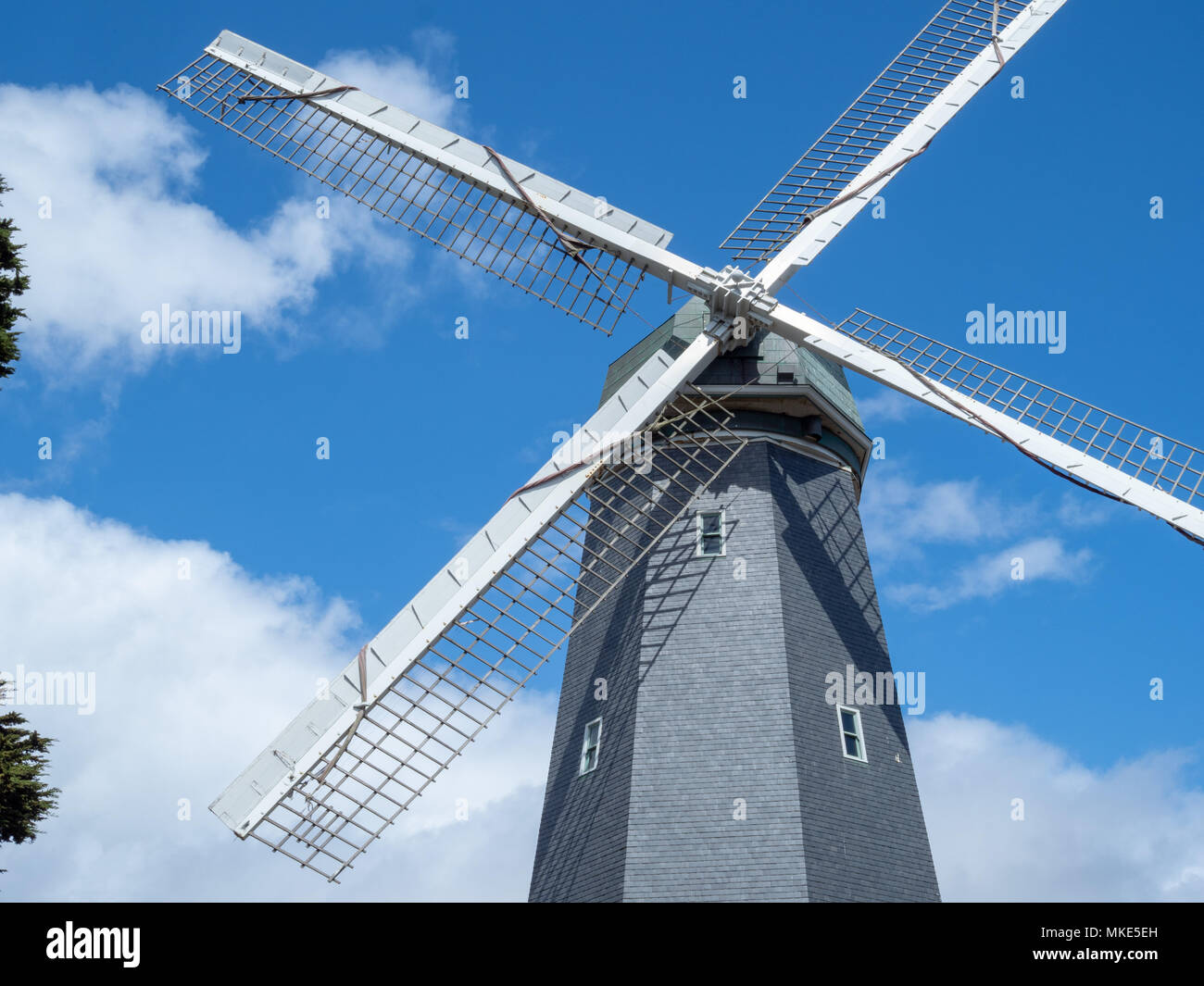 A large sun glowed windmill rotating in the outdoors Stock Photo - Alamy