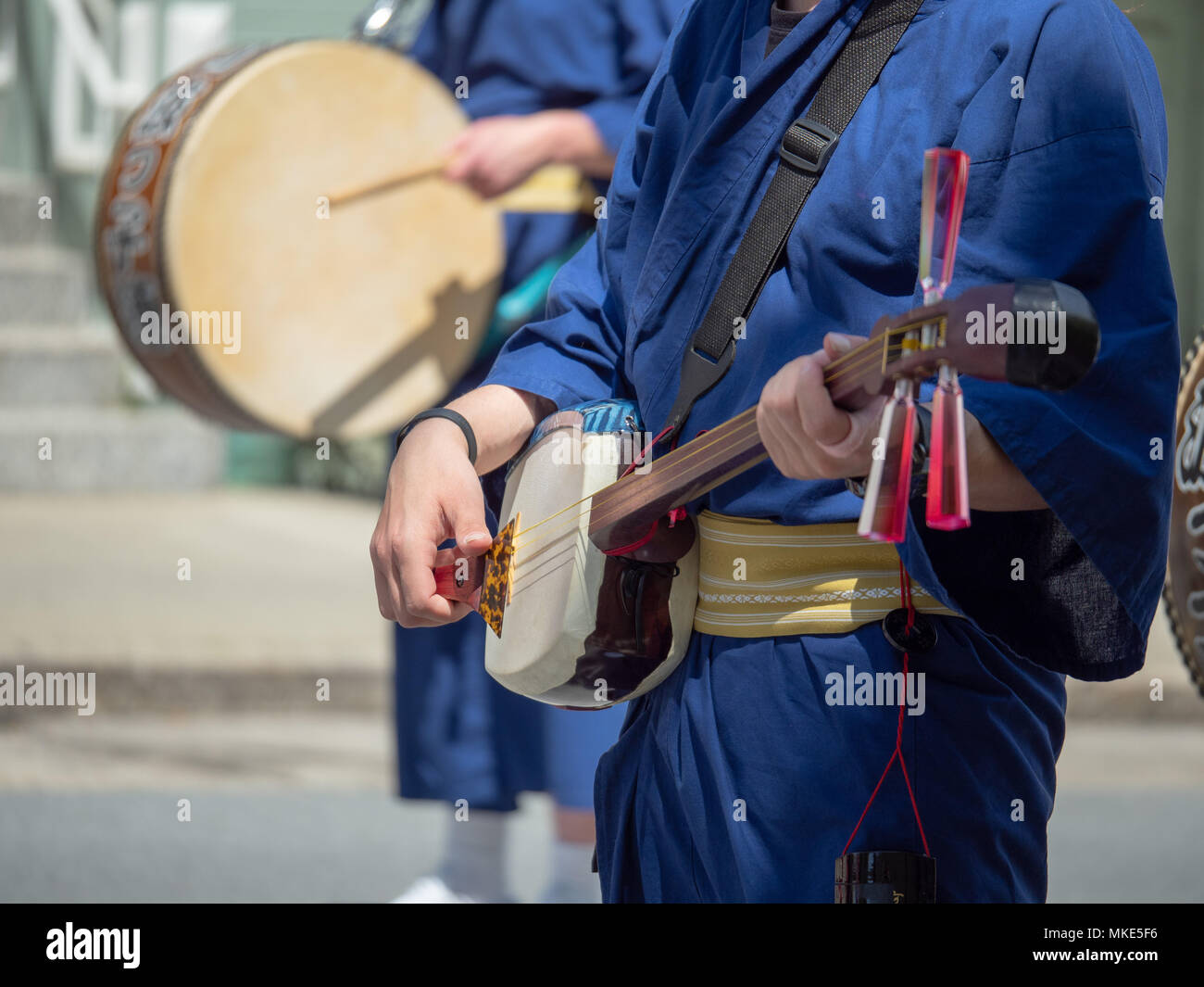 Man playing a traditional Japanese instrument shamisen as part of a ...