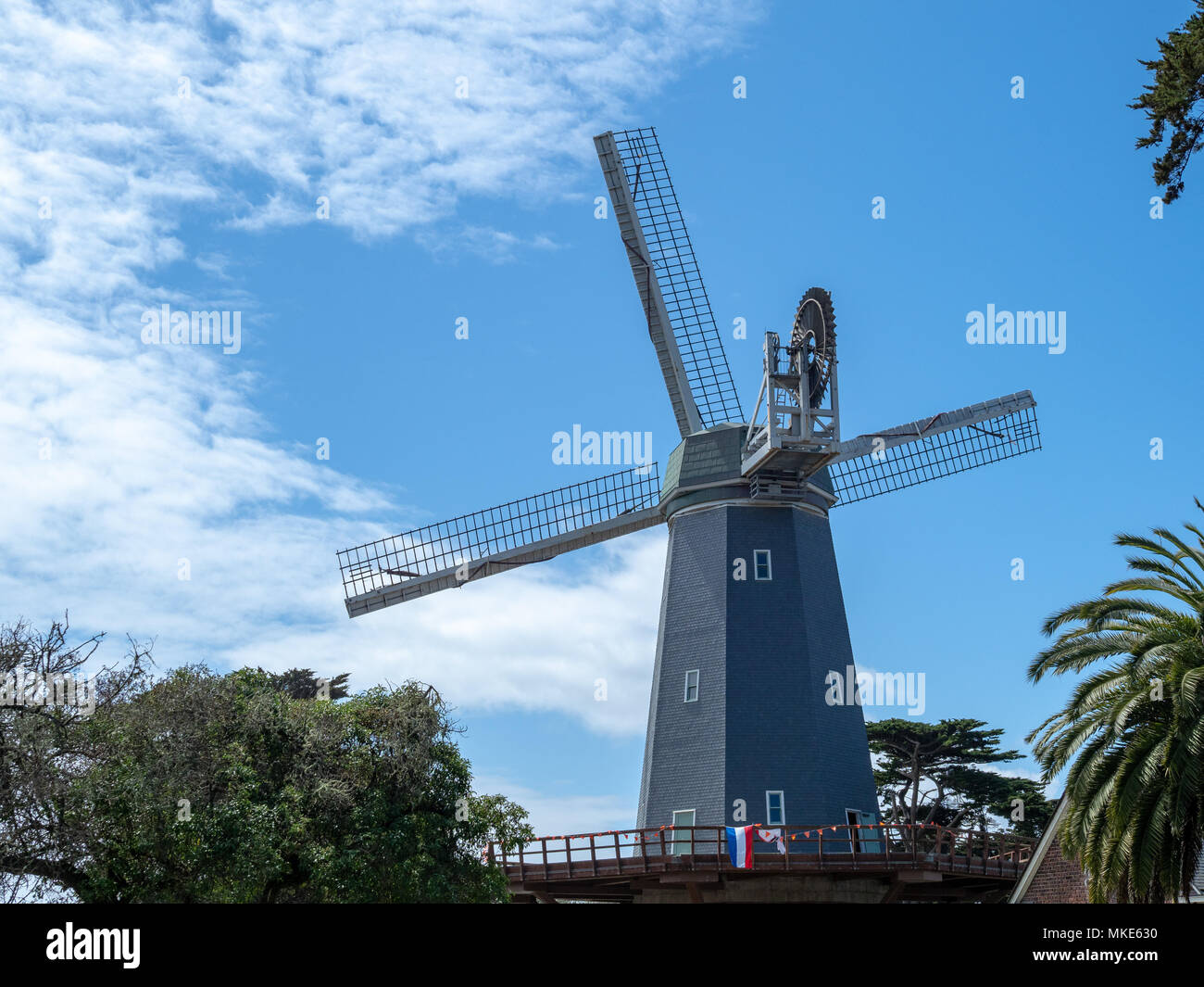 A decorative Dutch windmill with clouds moving to the left Stock Photo ...