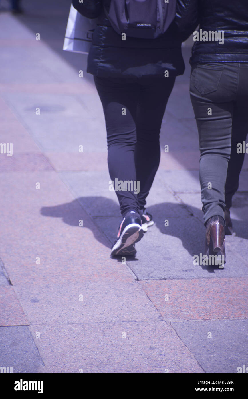 People walking in busy urban city shopping street sidewalk pavement ...