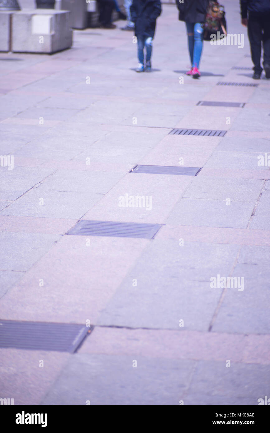 People walking in busy urban city shopping street sidewalk pavement ...