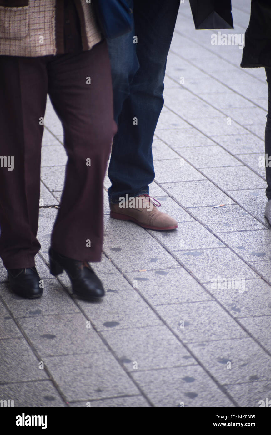 People walking in busy urban city shopping street sidewalk pavement ...