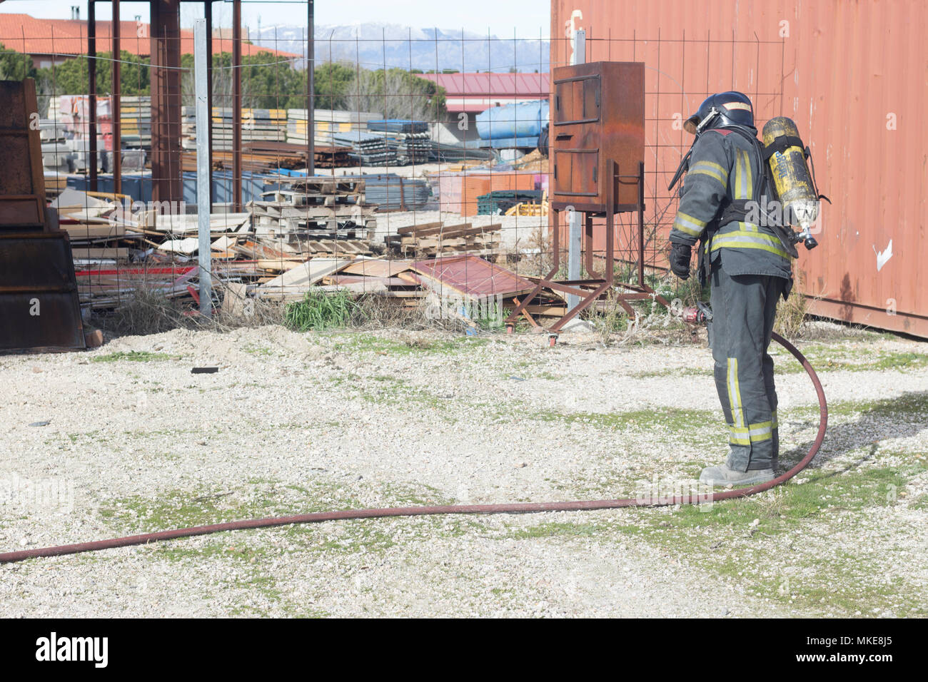 Firefighter putting out fire training station extinguisher backdraft ...