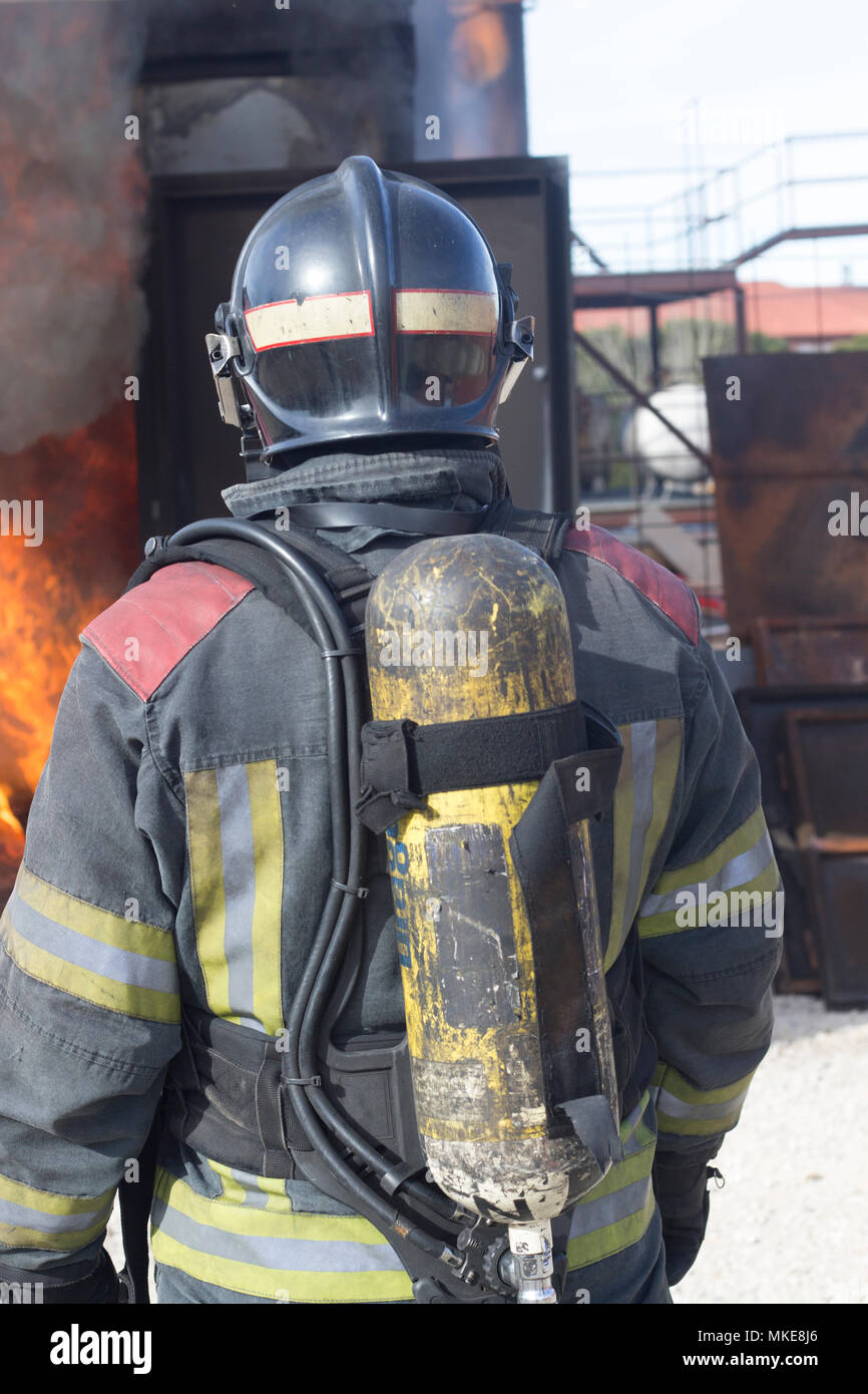 Firefighter putting out fire training station extinguisher backdraft ...