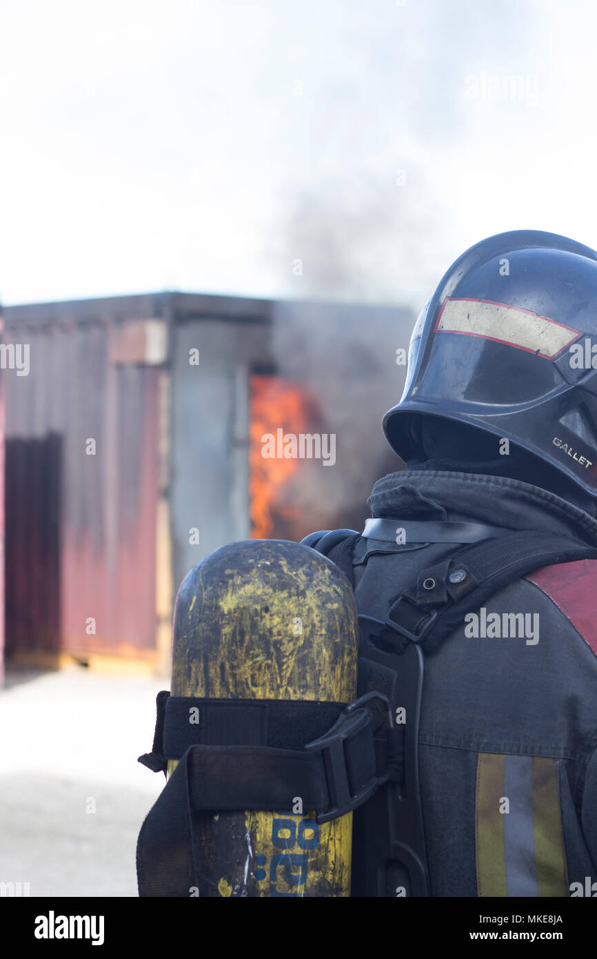 Firefighter putting out fire training station extinguisher backdraft ...