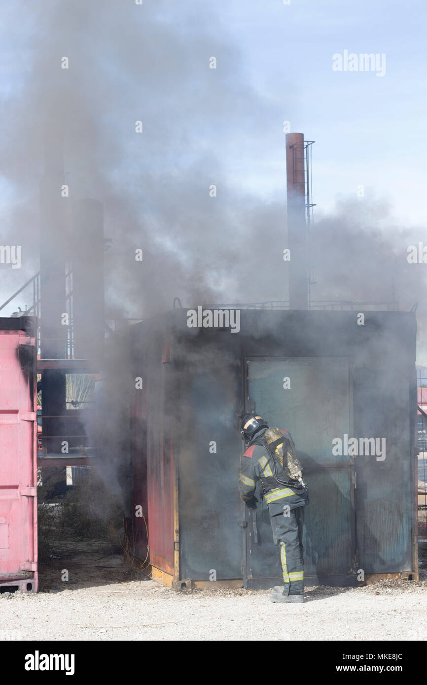 Firefighter putting out fire training station extinguisher backdraft ...