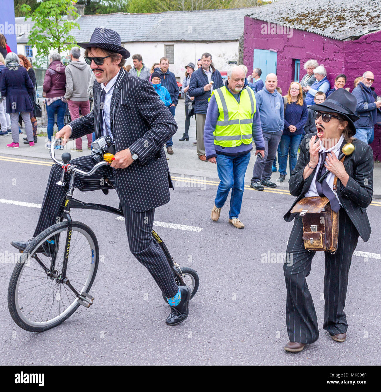 street performers taking part in a jazz festival street procession ...