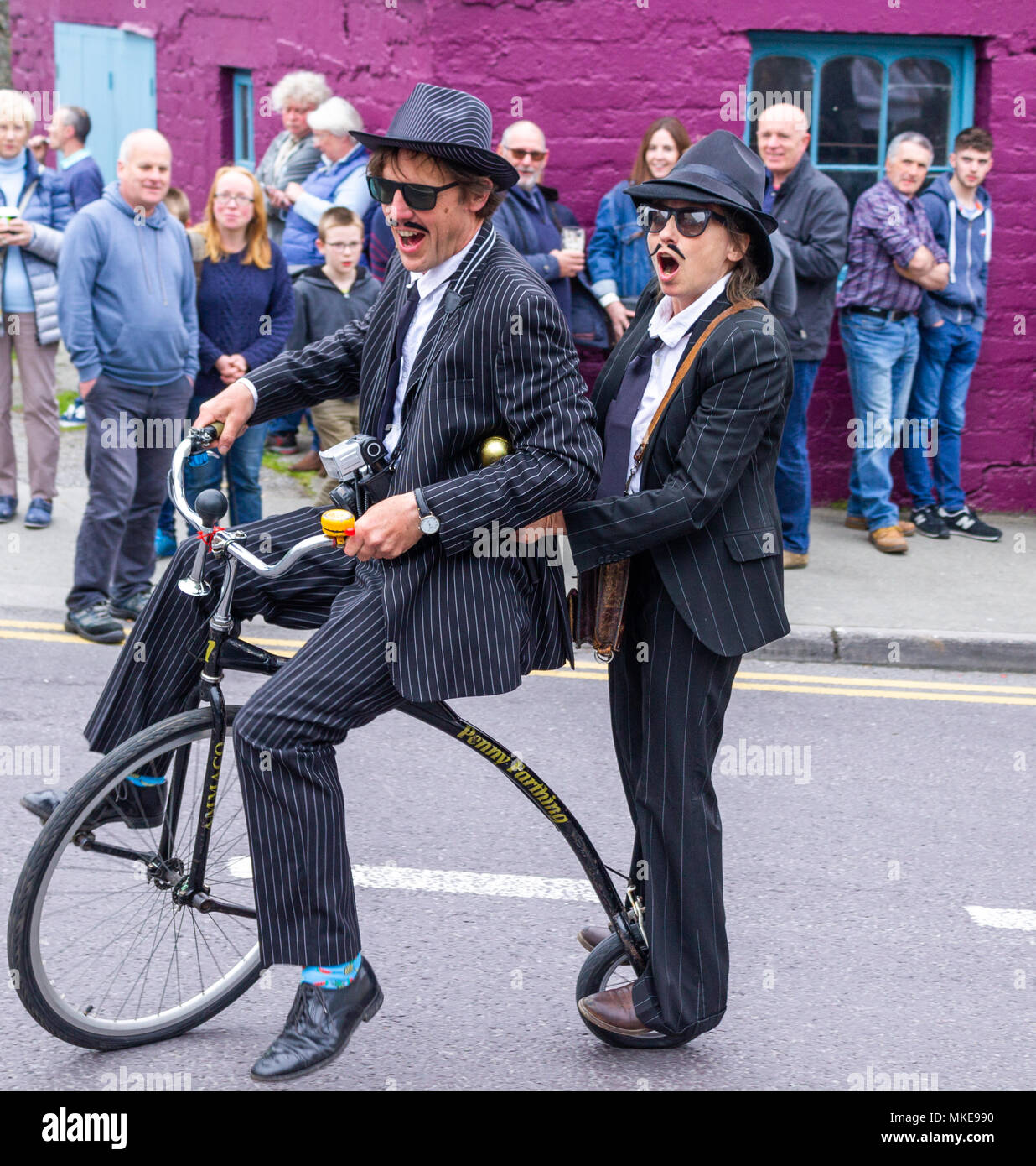 street performers taking part in a jazz festival street procession ...