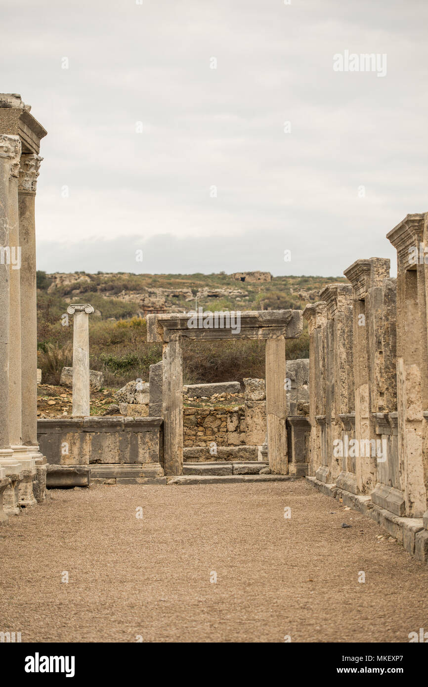 collonade and arch in ancient Perge. Vertical shot Stock Photo - Alamy