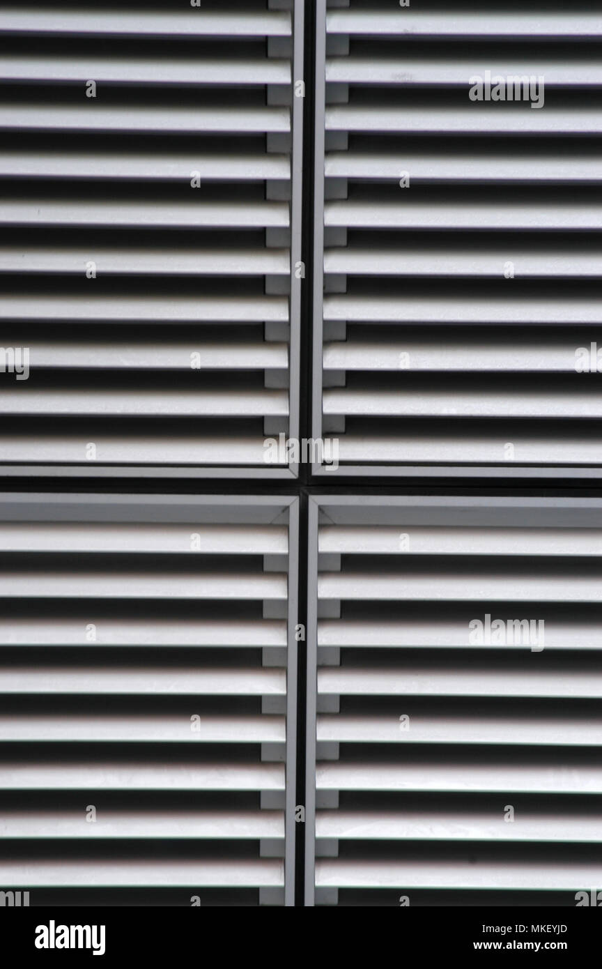 grill wall in building facade Stock Photo - Alamy
