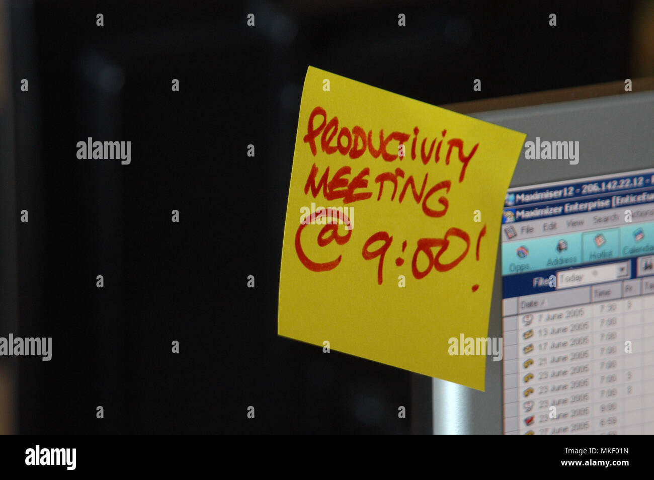 productivity meeting at 9am written on Post-it Note reminder stuck on ...