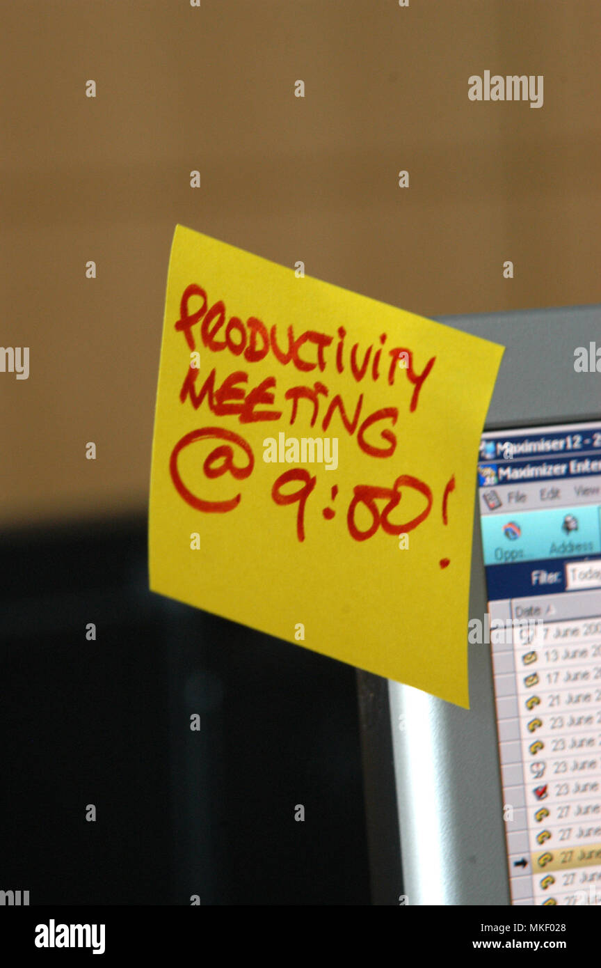 productivity meeting at 9am written on Post-it Note reminder stuck on ...