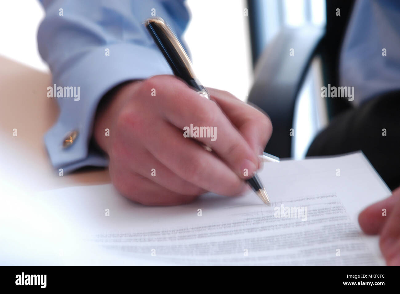city businessman signs document london Stock Photo - Alamy