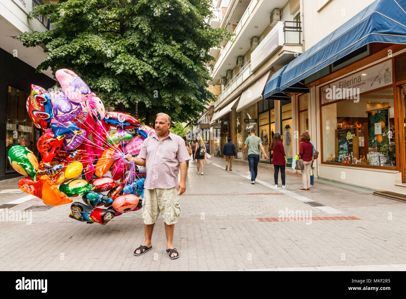 Street vendor selling balloons in hi-res stock photography and images ...