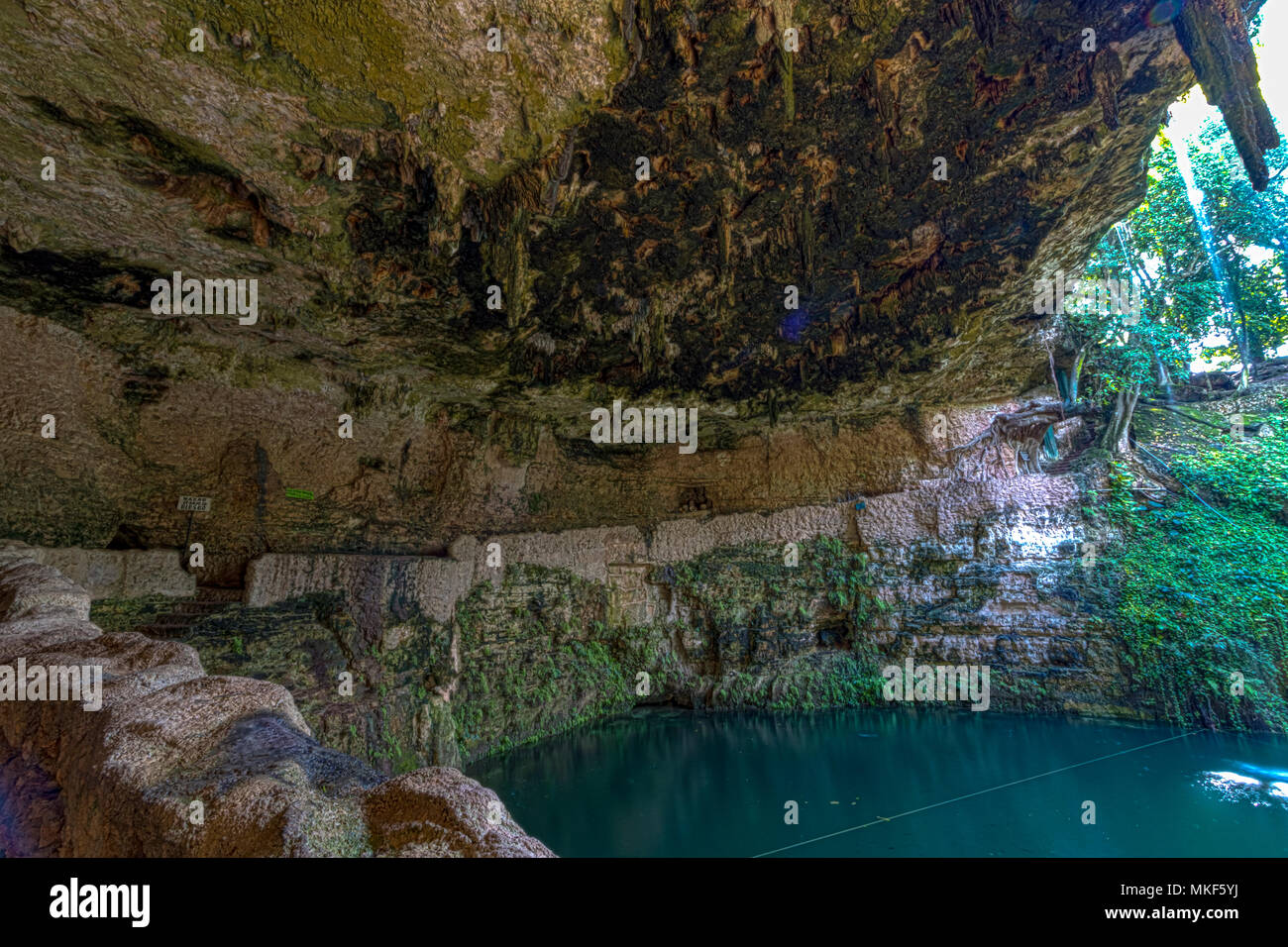 Cenote is a natural sinkhole, resulting from the collapse of limestone ...