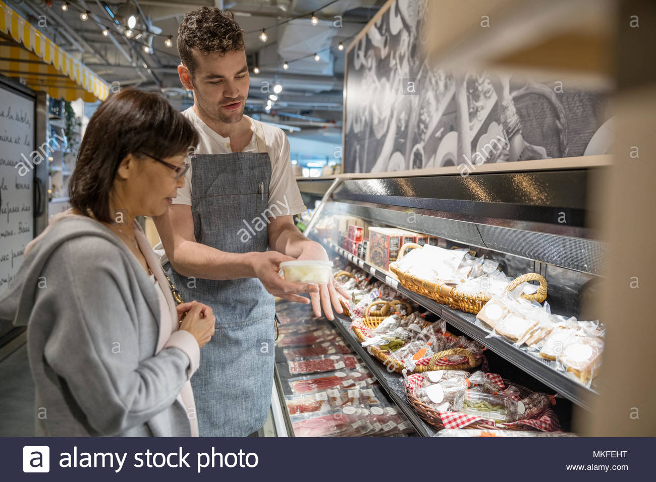 Supermarket deli worker hi-res stock photography and images - Alamy
