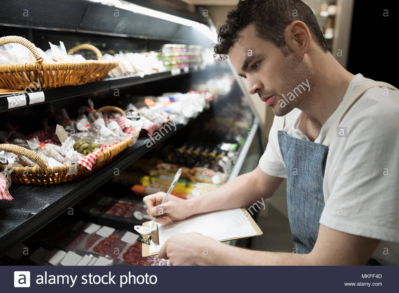 Supermarket deli worker hi-res stock photography and images - Alamy