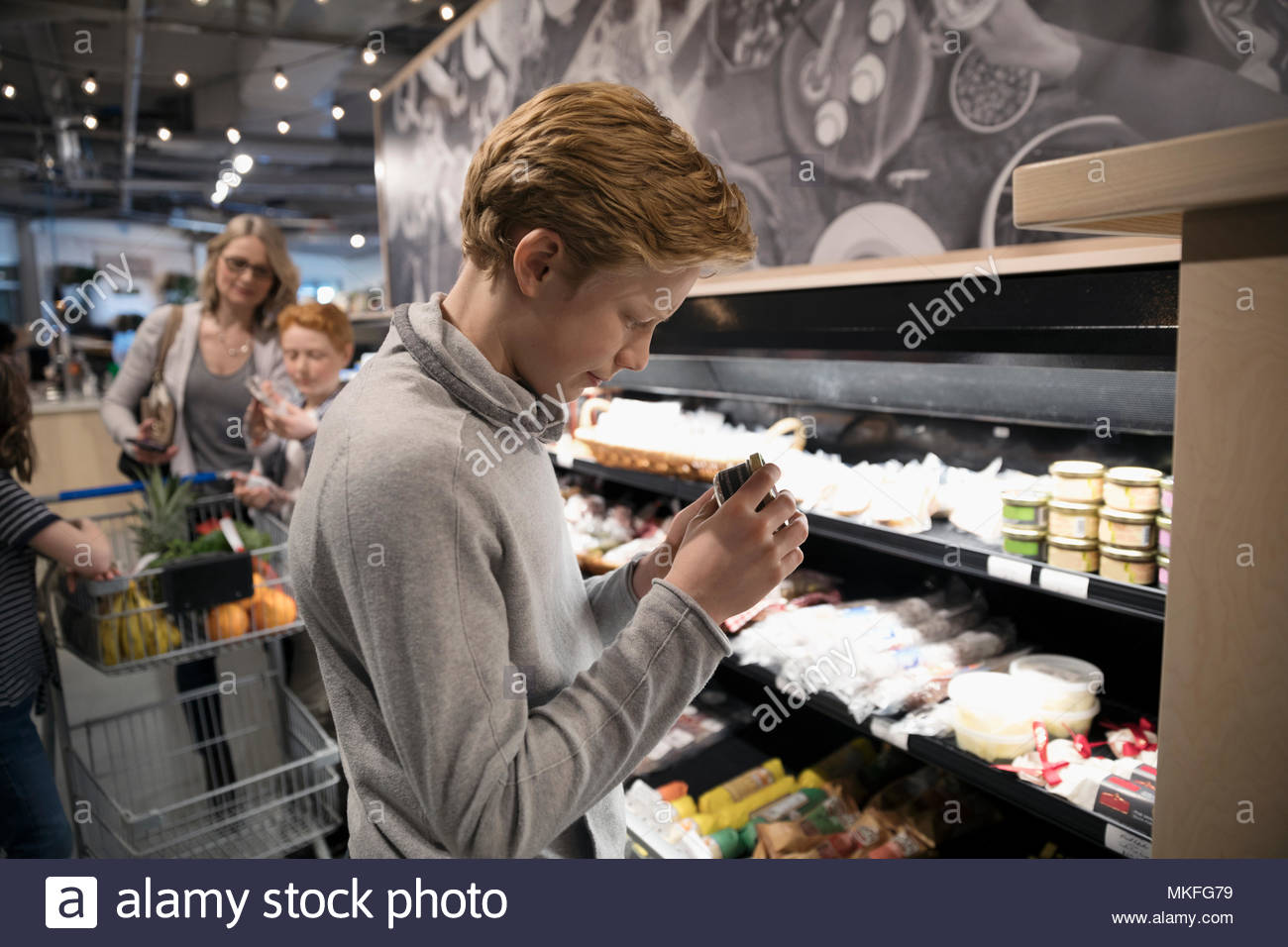 Boy shopping supermarket hi-res stock photography and images - Alamy