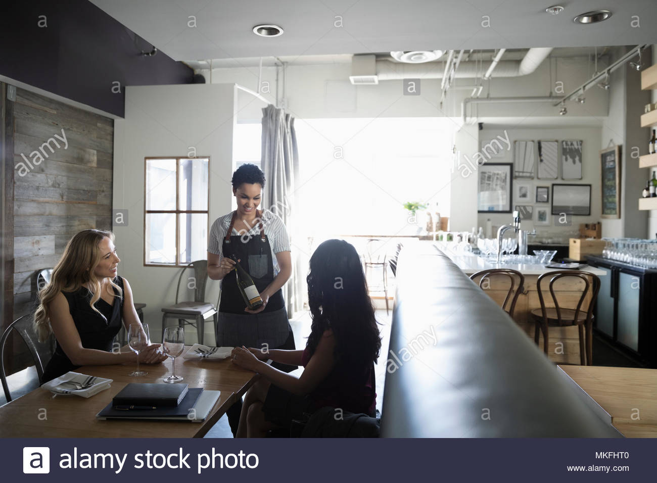 Waitress serving woman table in hi-res stock photography and images - Alamy