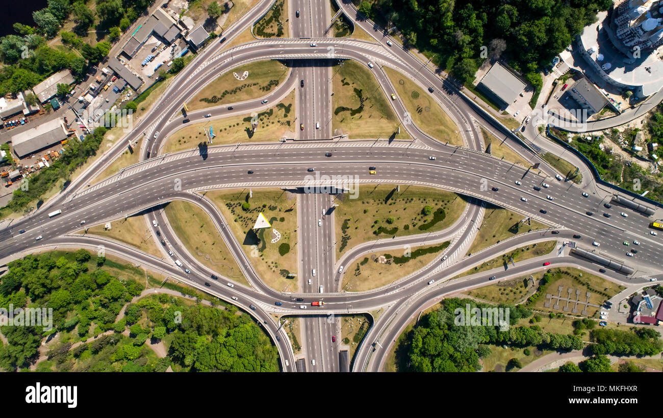 Aerial view of a turbine road interchange in Kiev. Cityscape in summer ...