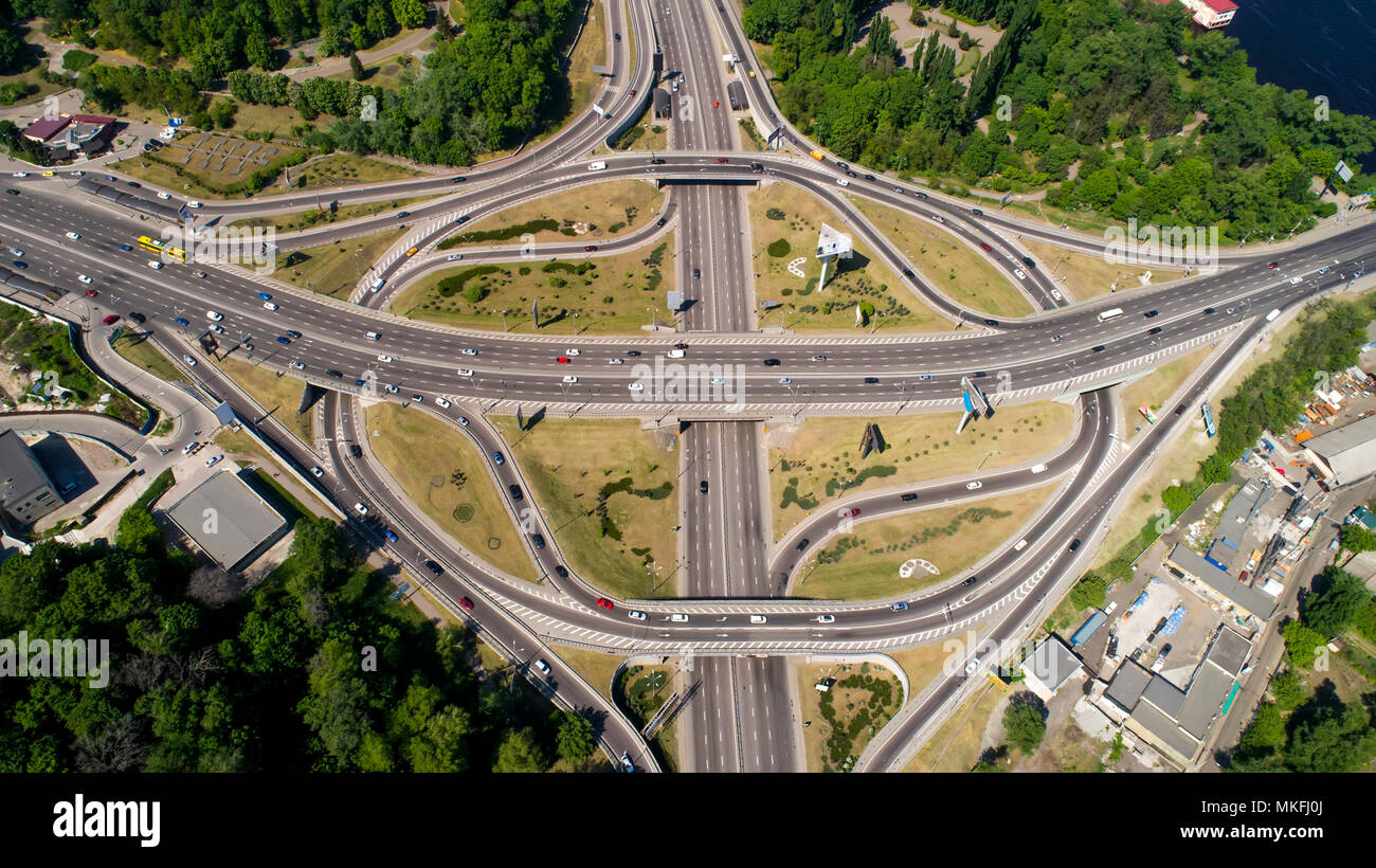 Aerial view of a turbine road interchange in Kiev. Cityscape in summer ...