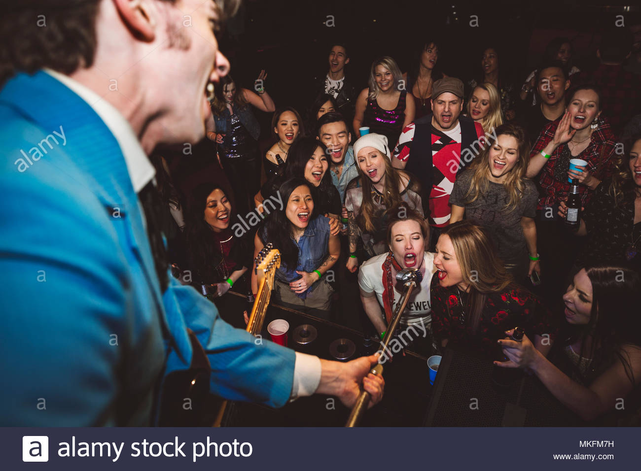 Happy singing crowd hi-res stock photography and images - Alamy