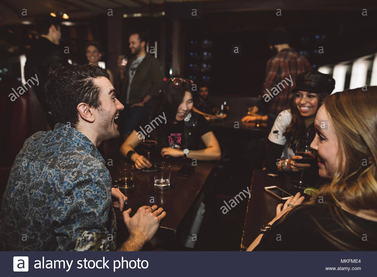 People in bar laughing hi-res stock photography and images - Alamy