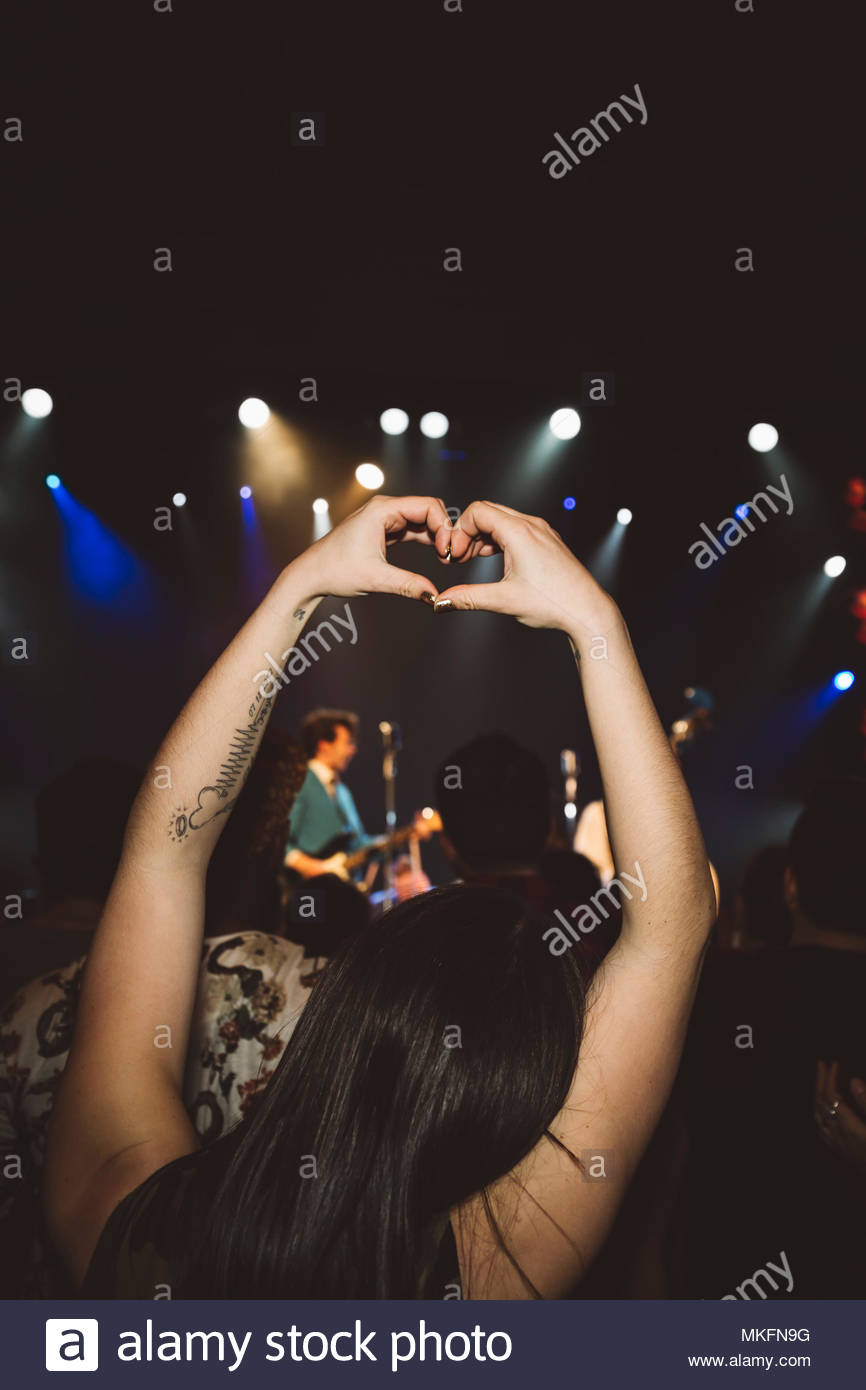 Rear view of a woman gesturing with her hands hi-res stock photography ...