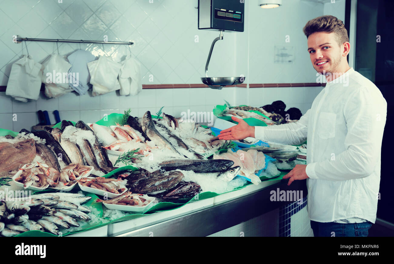 Adult customer buying fish and chilled seafood in shop Stock Photo - Alamy