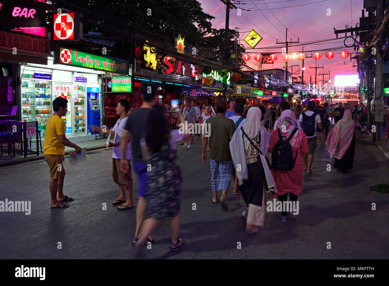 Tourists between bars, shops and restaurants on Bangla Road at dusk ...