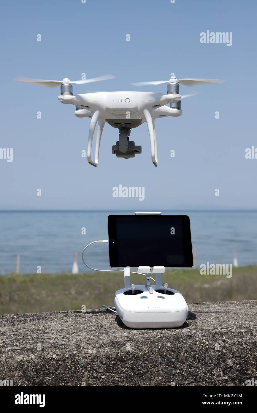 drone and remote controller, clear blue sky background Stock Photo - Alamy