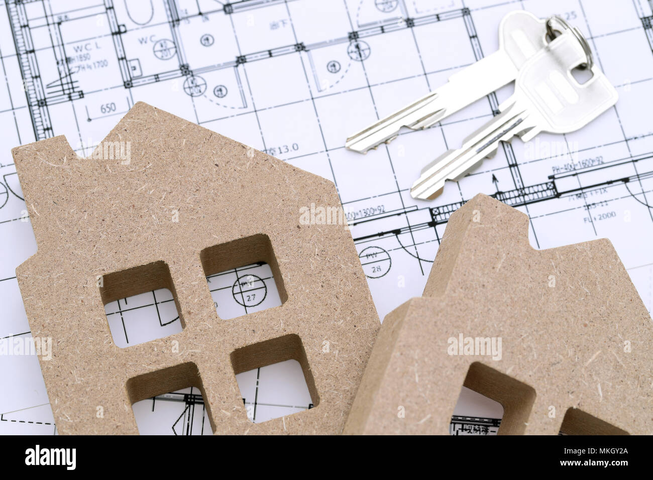Miniature model of house and keys on blueprint, construction plan Stock ...