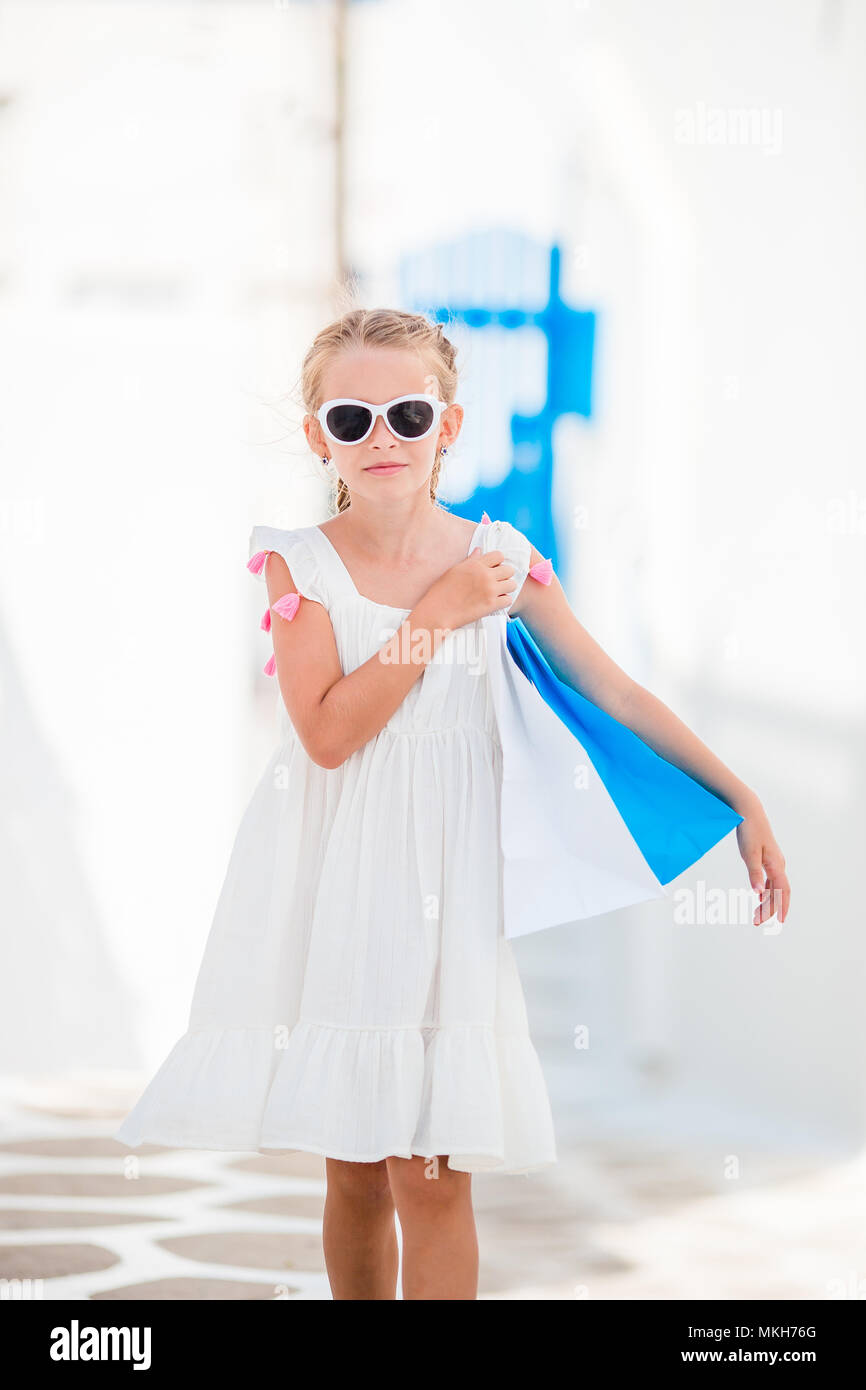Beautiful girl at street of typical greek traditional village on ...