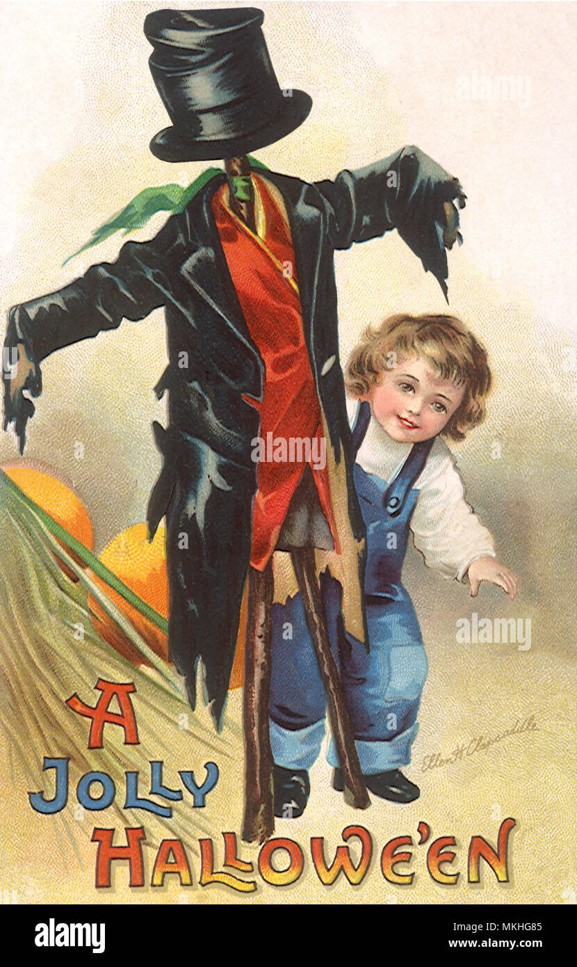 Boy next to Halloween Scarecrow Stock Photo - Alamy