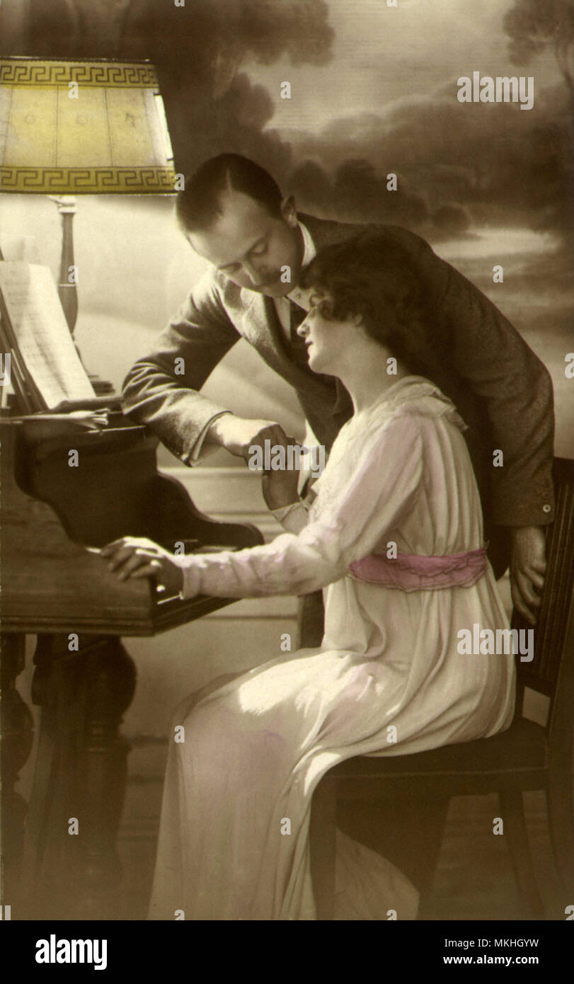 Couple at Piano Stock Photo - Alamy