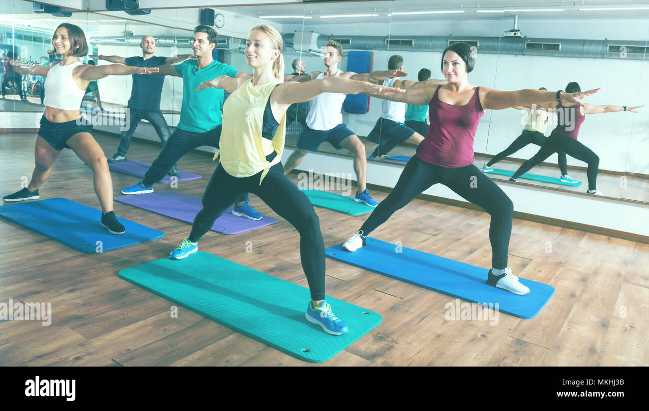 Active people training on mates at a fitness school Stock Photo - Alamy