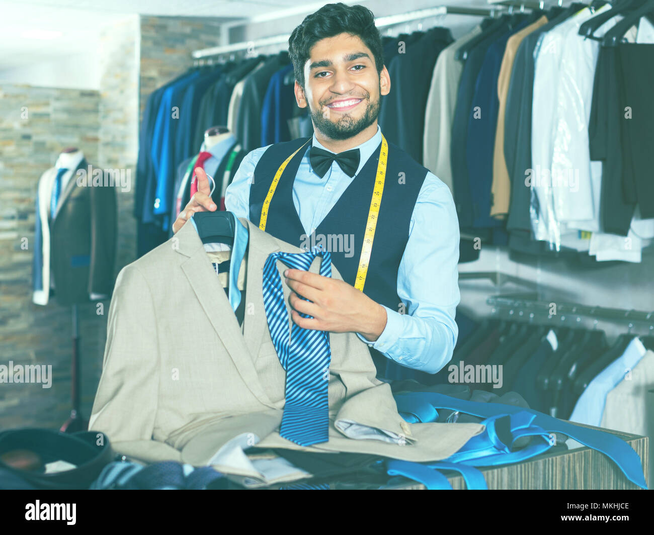 Designer is creating business image in men's clothes store Stock Photo ...