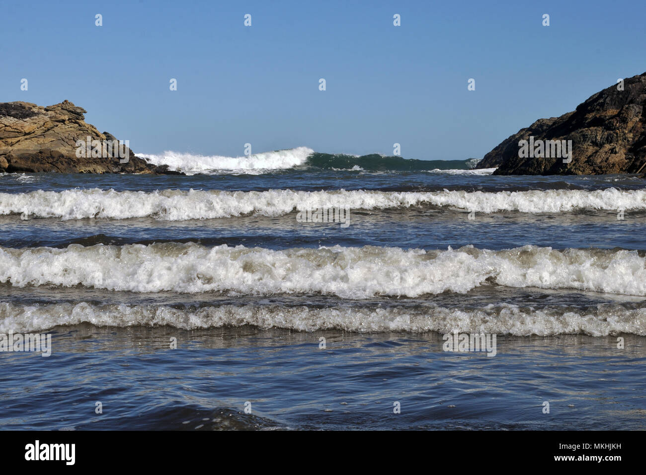 Incoming waves invade Constant Bay on the West Coast of New Zealand ...