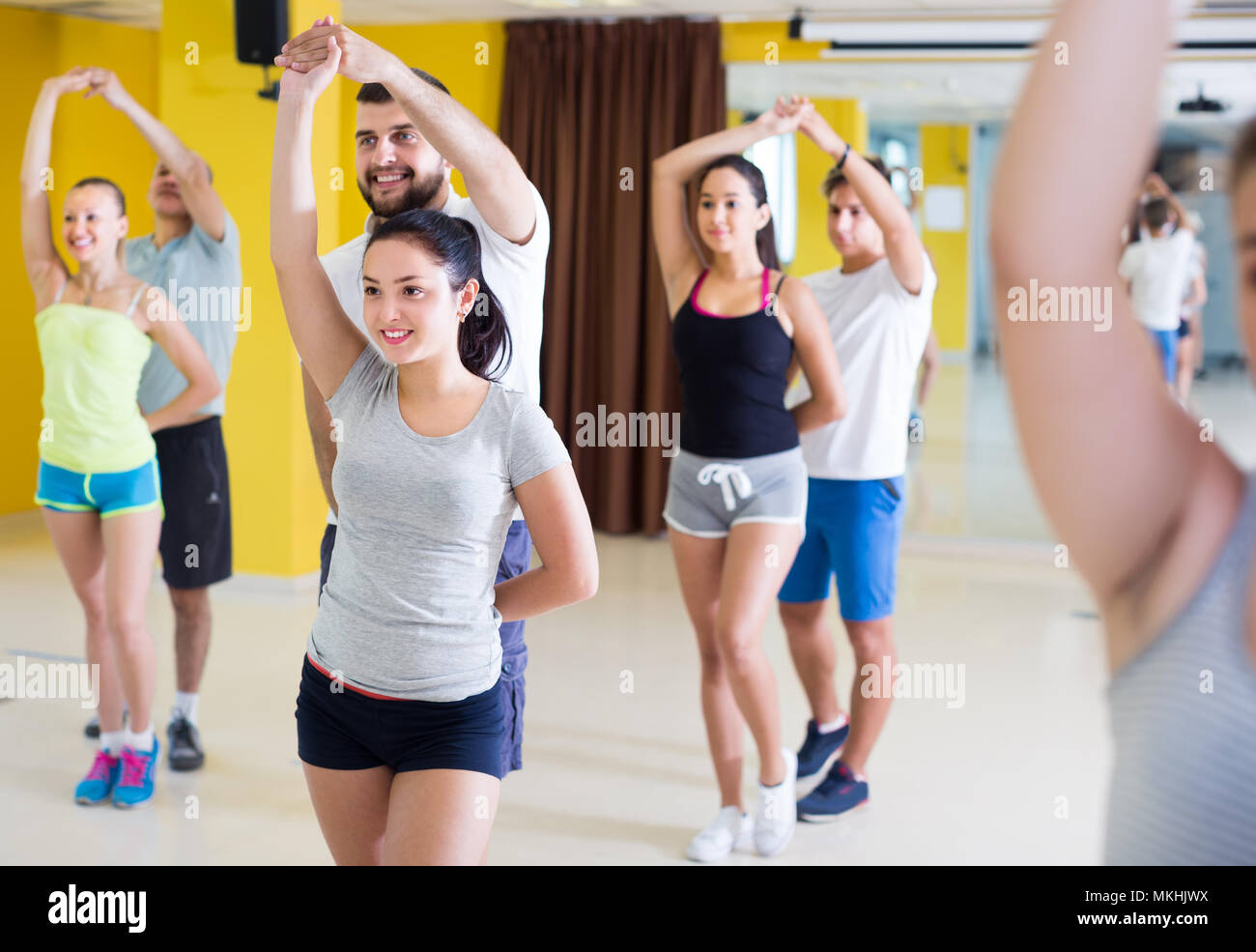 Positive people dancing salsa in dance hall Stock Photo - Alamy