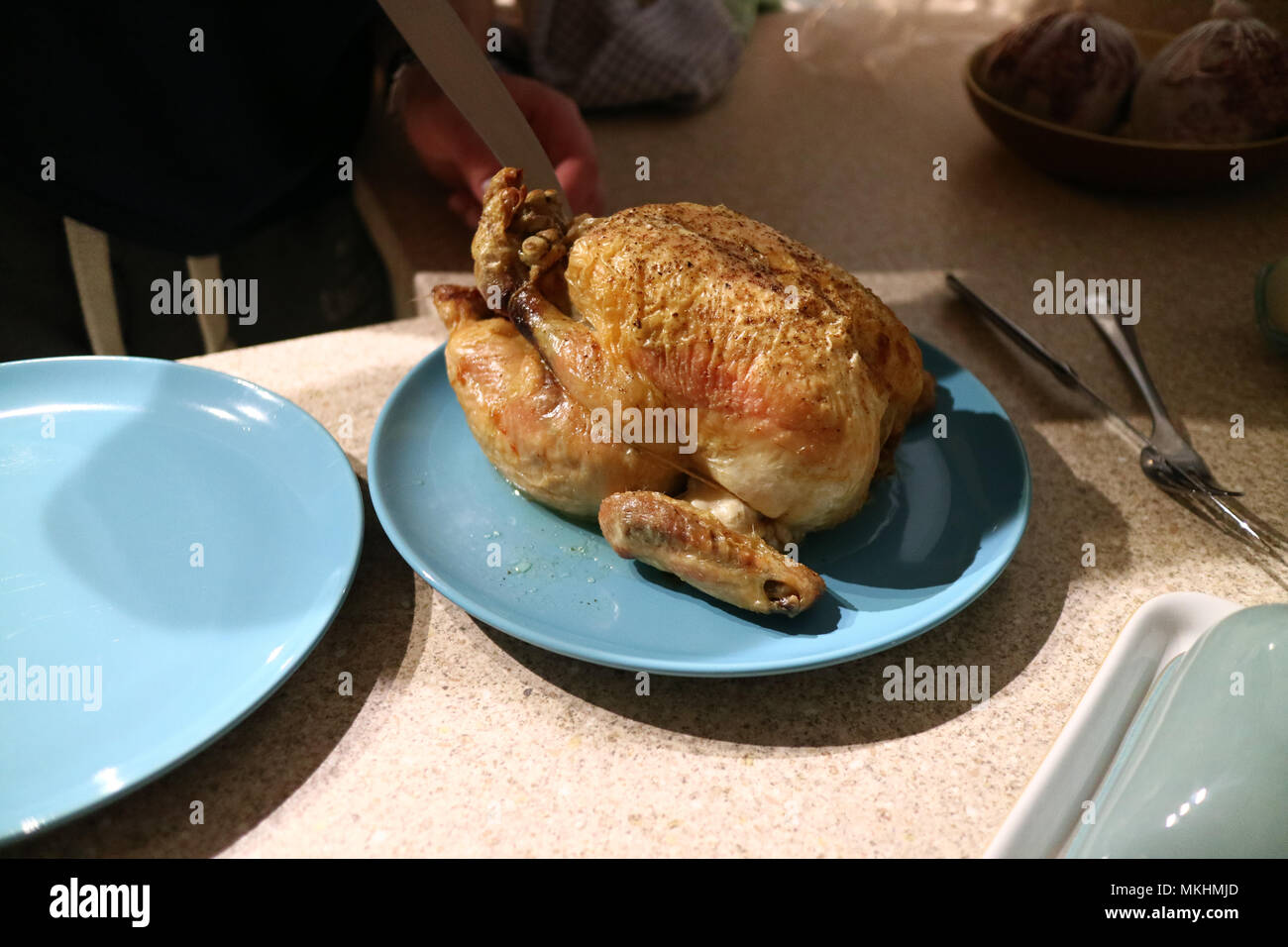 Side view of a freshly roasted chicken about to be carved Stock Photo ...